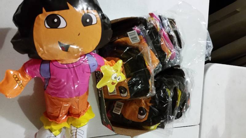 11 of these Dora plastic blow up dolls. We blew one up for the photos ...