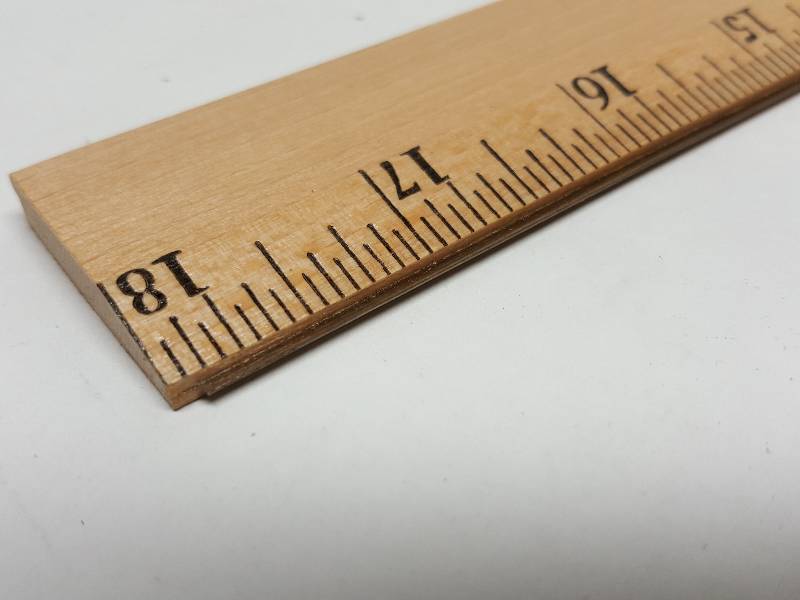 Good old fashioned wood desk ruler with metal strip on one side for ...