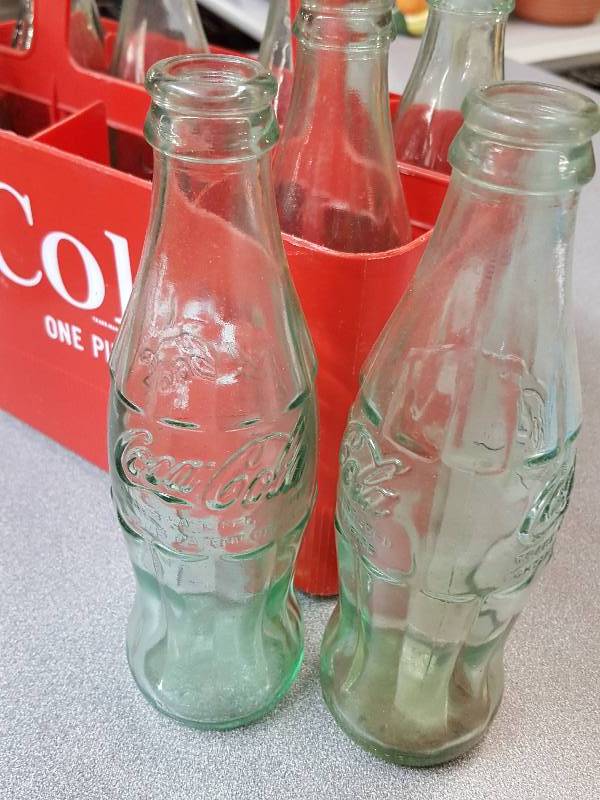 Case of 8 small real glass Coke bottles and these all look pretty good ...